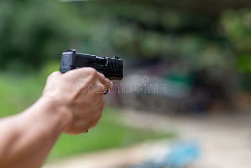 Selective Focus Pistol in Man S Hand Leaning Forward in Shooting Range ...