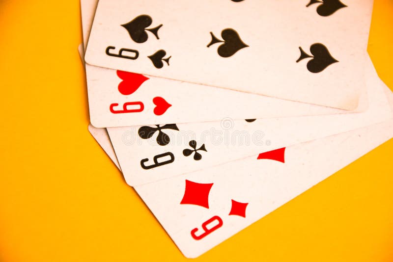 Selective Focus of Playing Cards on a Yellow Background Close Up Stock ...