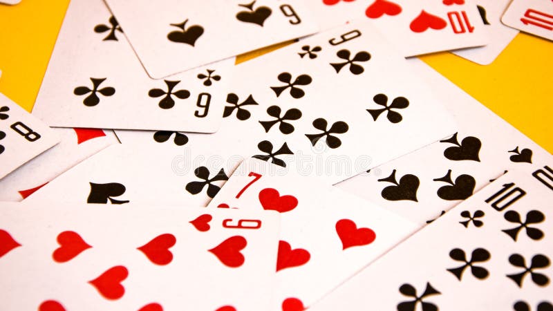 Selective Focus of Playing Cards on a Yellow Background Close Up Stock ...