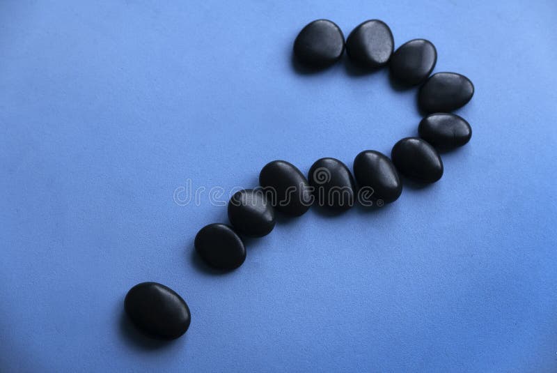 Selective Focus of Question Mark Symbol by Black Stone on Blue ...