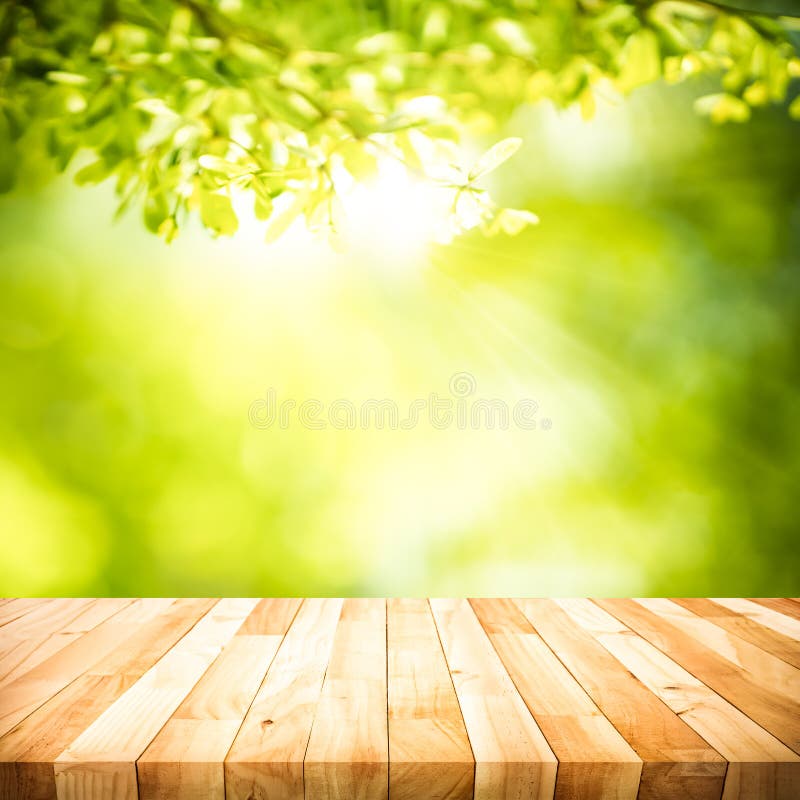 Real Wood Table Top Texture on Blur Fresh Green Garden Background Stock ...