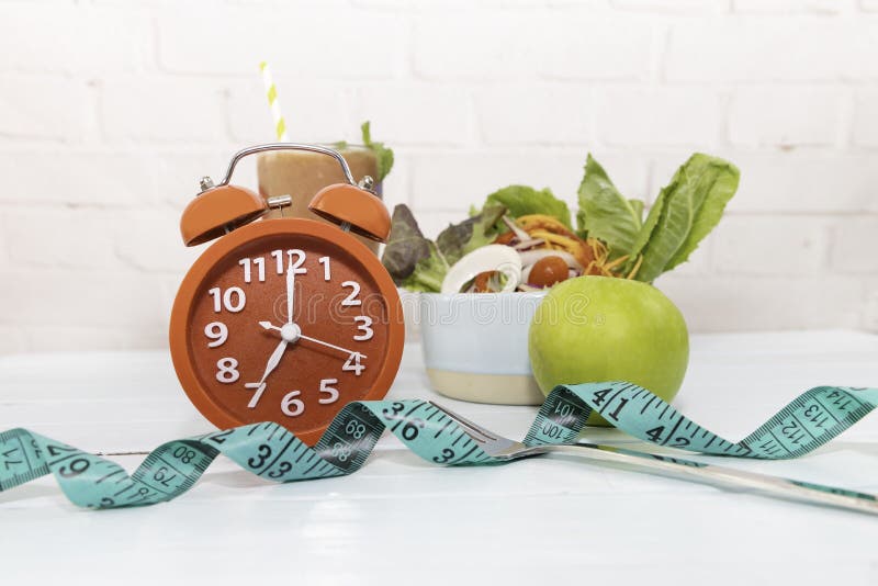Red Clock Which Intermittent Fast Program Concept and Healthy Food As ...