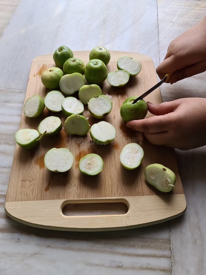 Selective Focus on Round Gourds Cutting with Knife on Wooden Chopping ...