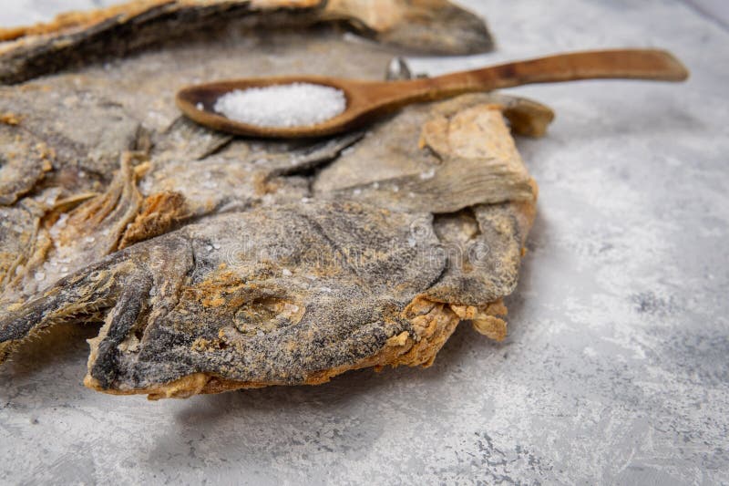 Selective Focus of a Salted Cod Head with a Wooden Spoon with Grains of ...