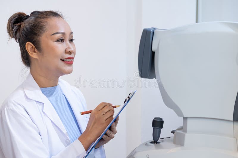 Selective Focus at Screen of Optometry Equipment. while Optometrist ...