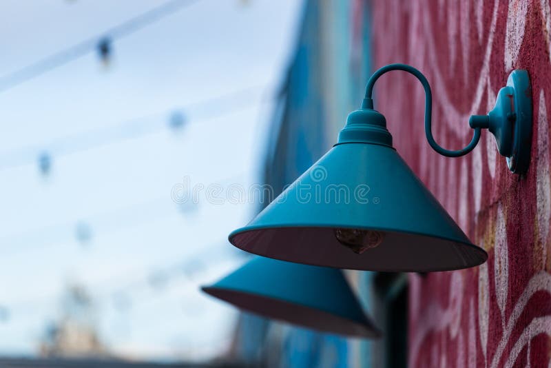 Selective Focus Shot of Blue Lamp Post Against the Wall Stock Image ...