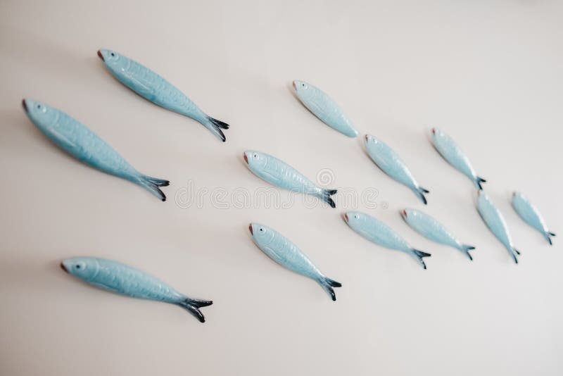 Selective Focus Shot of Blue Plastic Fish on a White Background Stock ...
