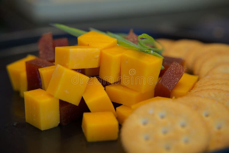 Selective Focus Shot of Cube Fruits and Crackers on a Board Stock Photo ...