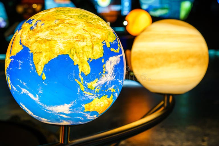 Selective Focus Shot of an Illuminated Round Earth Lamp in a Solar ...
