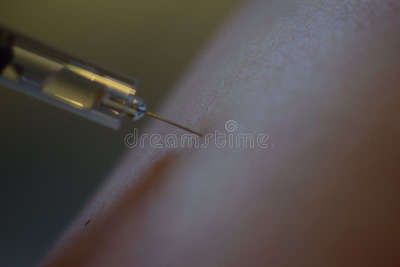 Selective Focus Shot of an Injection into the Arm Stock Photo - Image ...