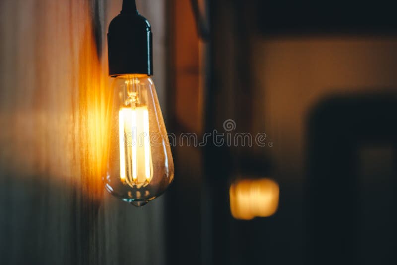 Selective Focus Shot of a Lamp Spreading Light Around in the Middle of ...