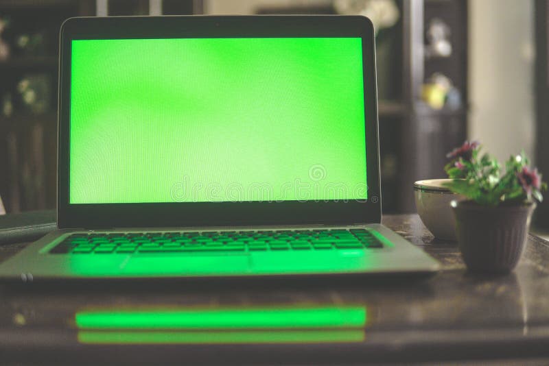 Selective Focus Shot of a Laptop Computer Showing Green Chroma Key ...