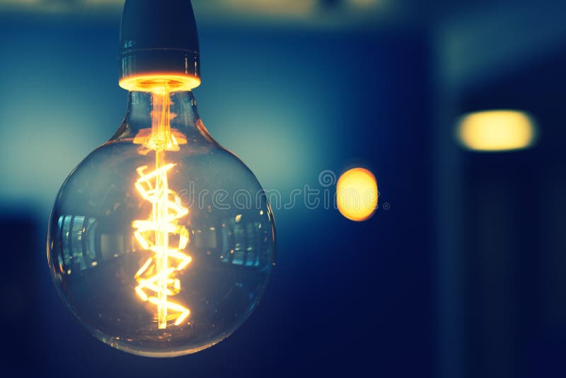 Selective Focus Shot of a Lighted Light Bulb Stock Photo - Image of ...