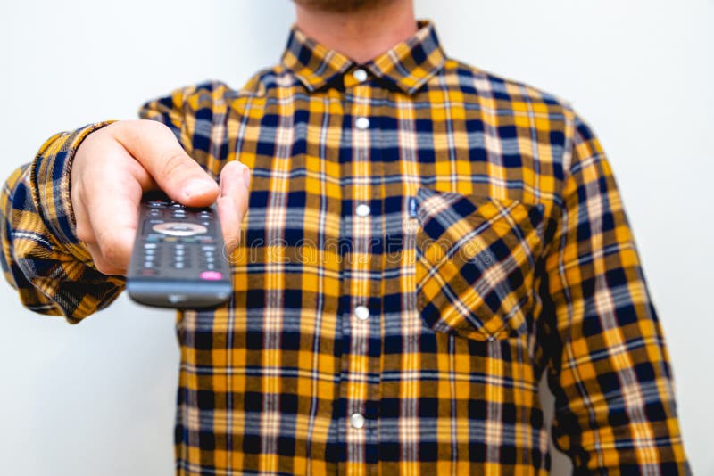 Selective Focus Shot of a Man in a Yellow Flannel Shirt Pointing a ...