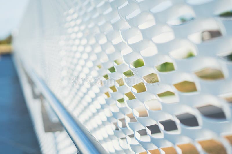 A Selective Focus Shot of Mesh Fence Stock Photo - Image of sunny ...
