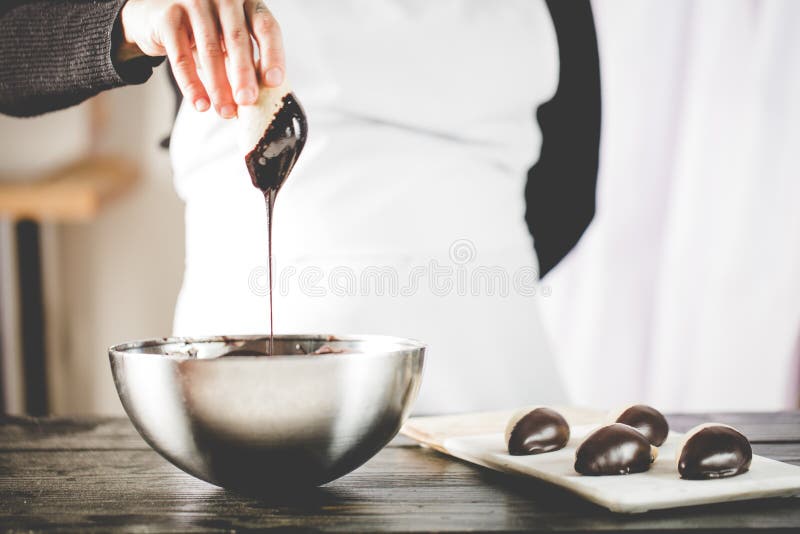 Selective Focus Shot of a Person Dripping Cookies in a Chocolate Stock ...