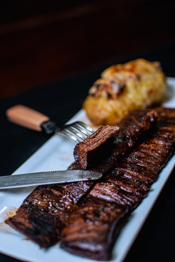 Selective Focus Shot of a Piece of Fresh Tasty Grilled Steak on a Fork ...