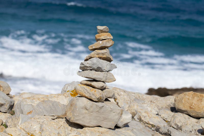 Selective Focus Shot of a Pyramid Made of Rocks on a Beach with an ...