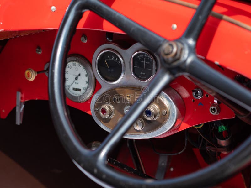 Selective Focus Shot of a Red Vintage Car Panel and a Steering Wheel ...