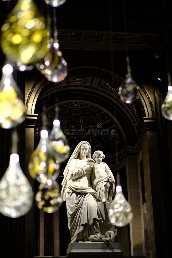 Selective Focus Shot of a Statue Illuminated by Multiple Lightbulbs ...
