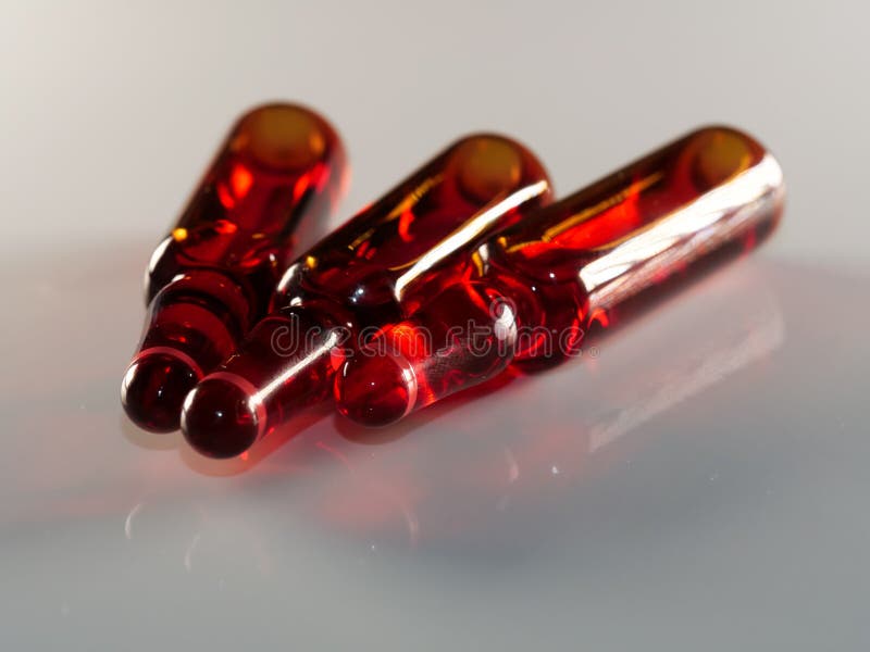 Selective Focus Shot of Three Red Ampoules Isolated on a White ...