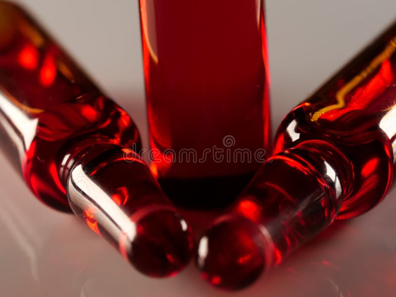 Selective Focus Shot of Three Red Ampoules Isolated on a White ...