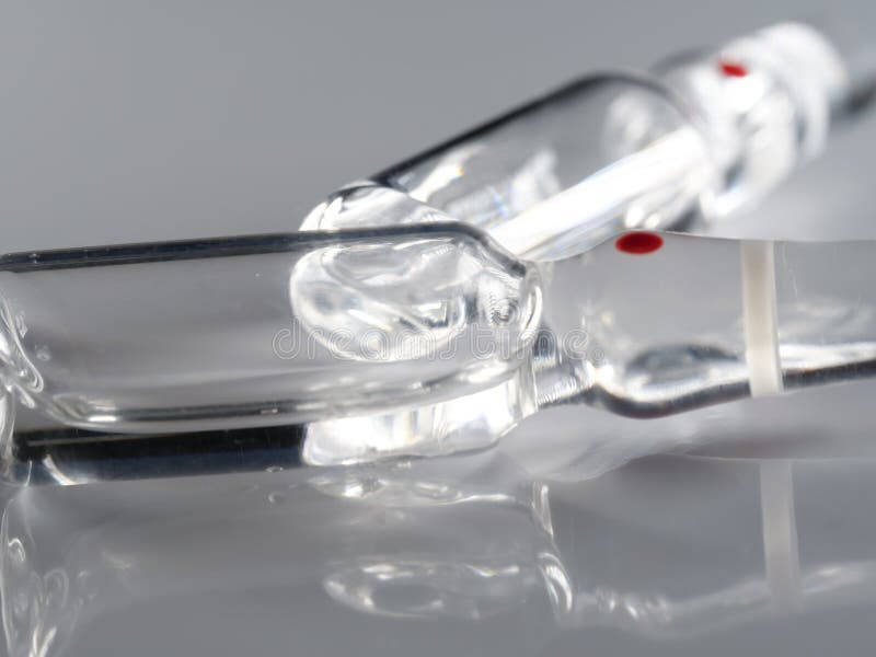 Selective Focus Shot of Transparent Ampoules Isolated on a White ...
