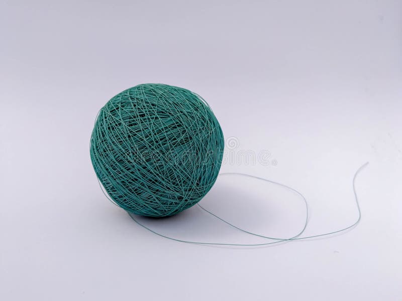 Selective Focus Shot of a Turquoise Thread Yarn Isolated in a White ...