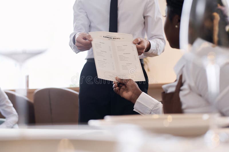 Unrecognizable Waiters Learning New Menu Stock Image - Image of learn ...