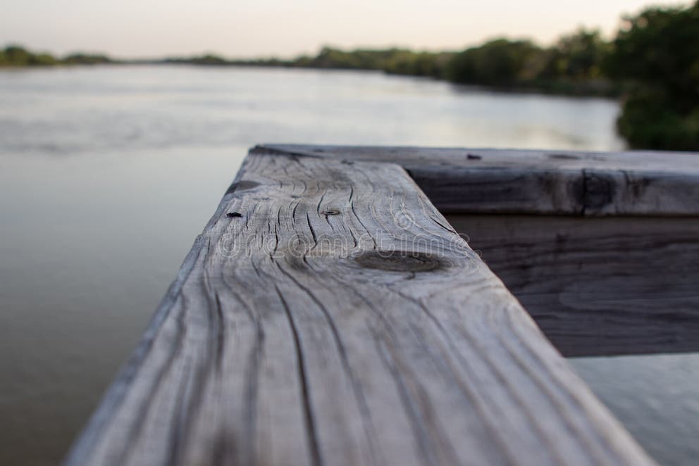 Selective Focus Shot of a Wooden Railing from a Bridge Stock Photo ...