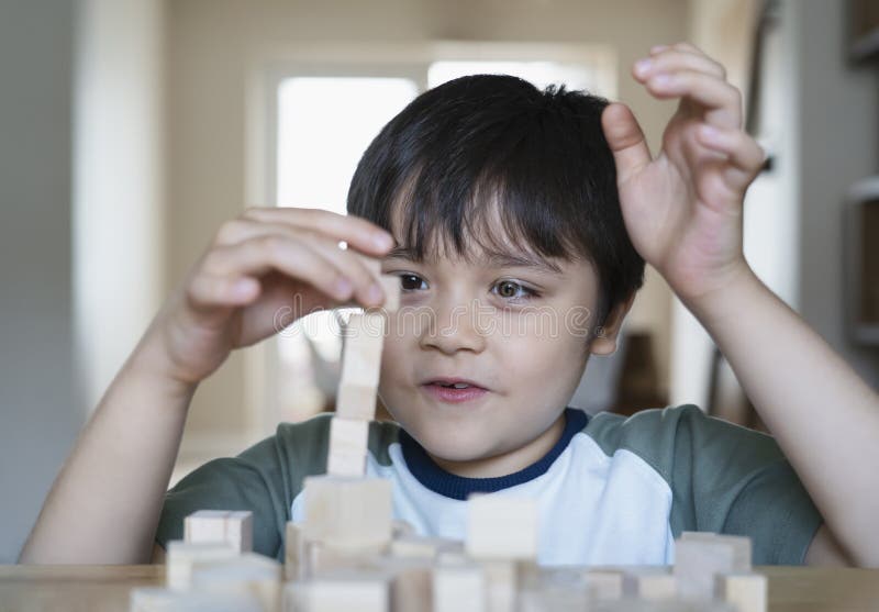 Selective Focus Smart Kid Building the Tower Stack from Wooden Blocks ...