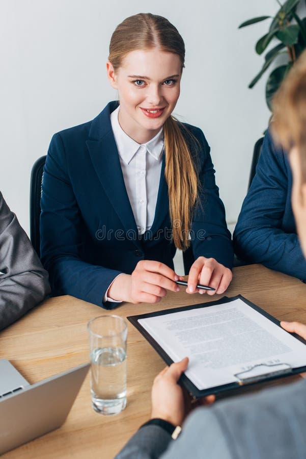 Smiling Recruiters Clapping and Looking at Camera Near Documents and ...