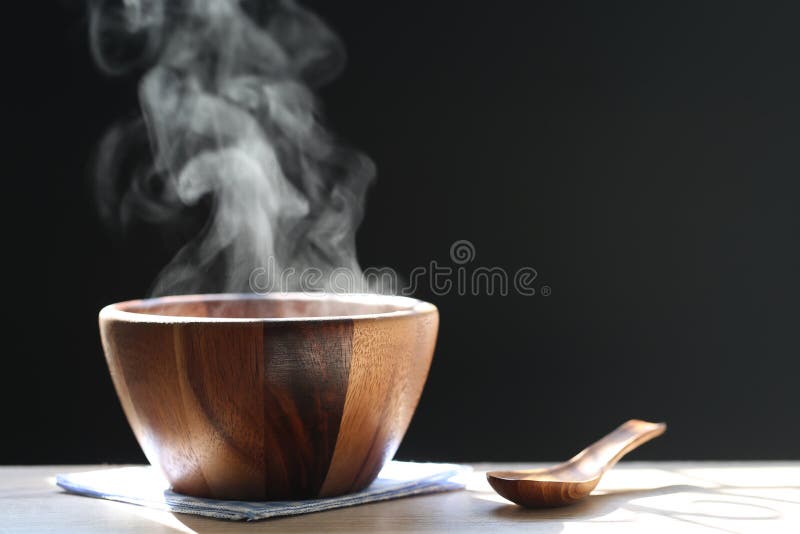 Selective Focus of Smoke Rising with Hot Soup in Cup on Dark Background ...