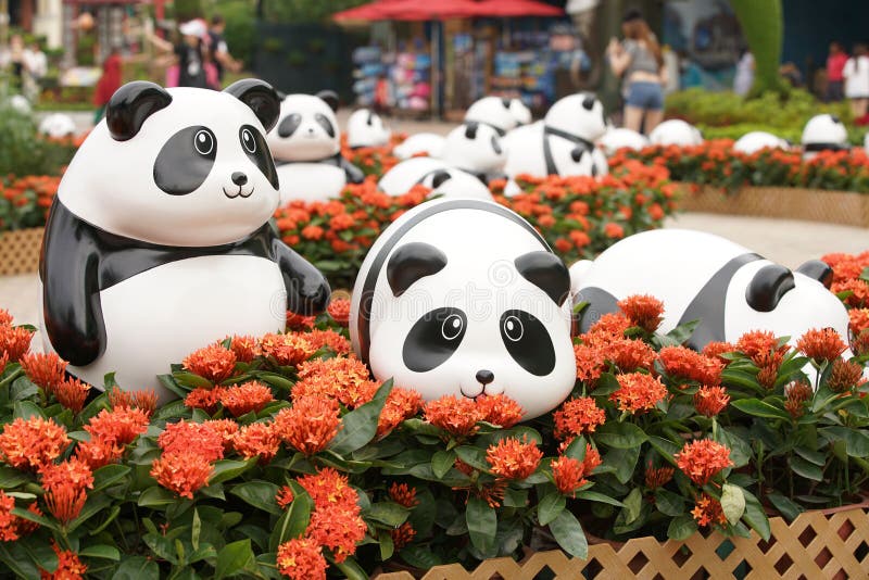 Selective Focus of Some White Toy Pandas in a Flower Garden Editorial ...