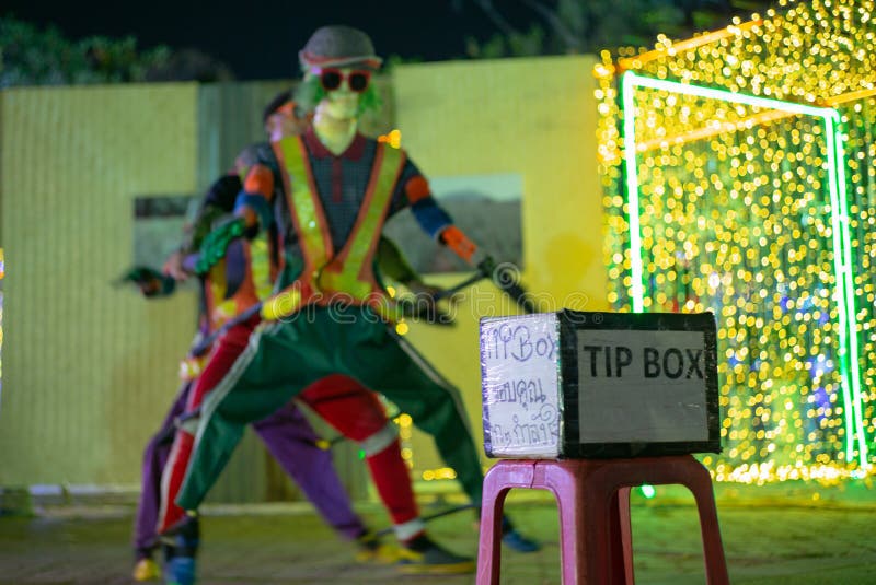 Selective Focus on Tip Box in Front of the Dancing Performance on the ...