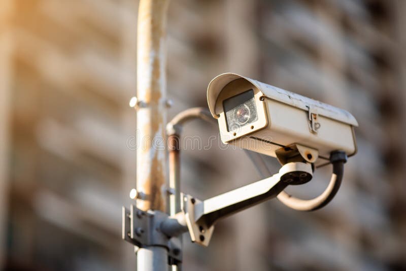 Selective Focus To CCTV Camera with Blurry Building Stock Photo - Image ...