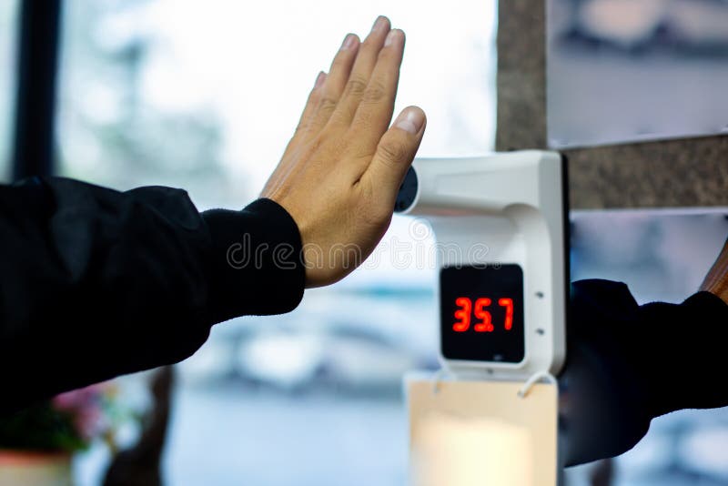 Selective Focus To Hand with Temperature Scanning Machine for Fever ...