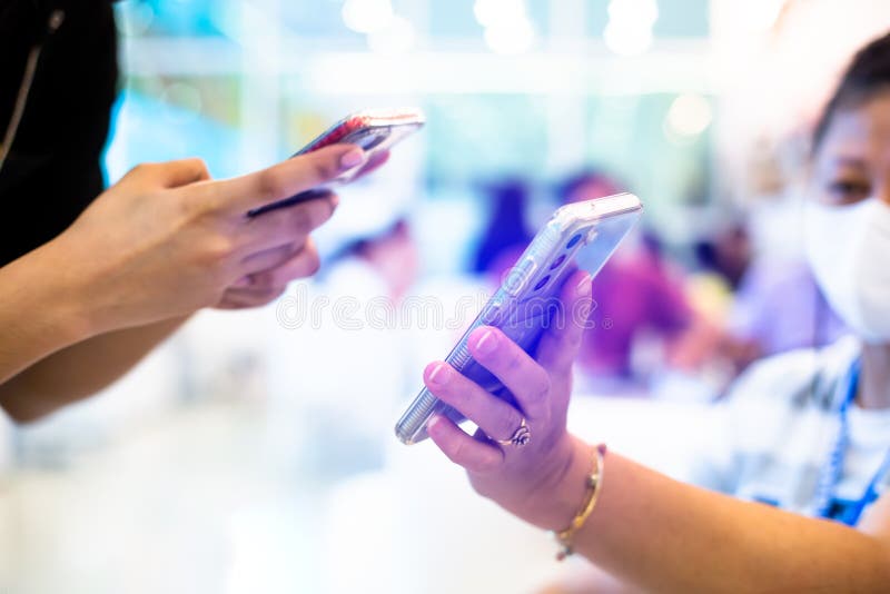 Selective Focus To Smartphone in the Hands of Customer and Merchant To ...