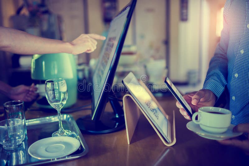 Selective Focus To Tablet and Blurry Customer Using Smart Phone Scan QR ...