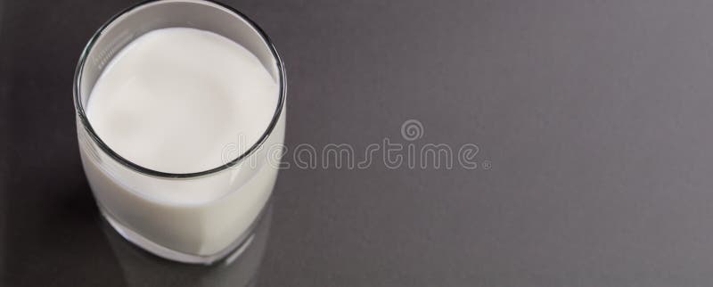 Selective Focus Top View of a Clear Glass of Milk Against the ...