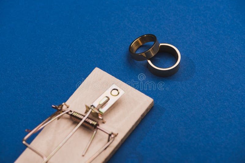 Selective Focus of Two Golden Rings with Mouse Trap Stock Image - Image ...