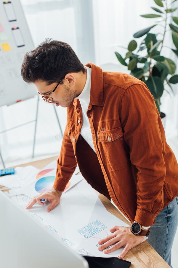 Selective Focus of Ux Developer Looking at Wireframe Sketches of Ux ...