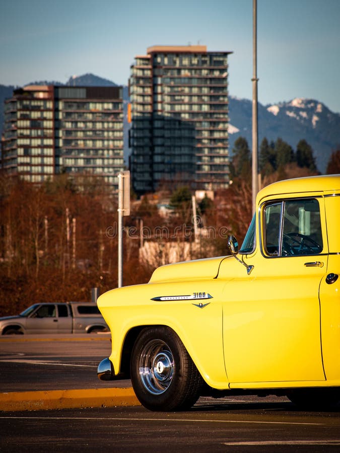 Selective Focus Vertical View of a Classic Yellow Chevy Truck in ...