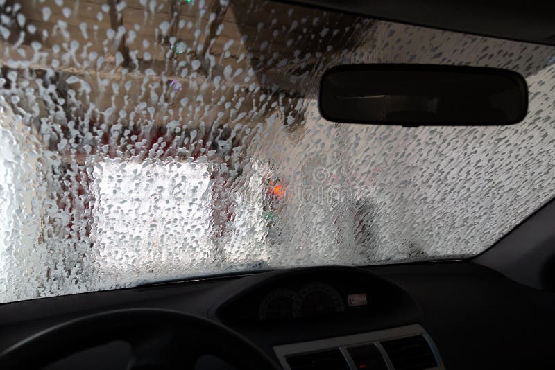 Car Windshield Covered in Soap and Water Seen from the Interior during ...