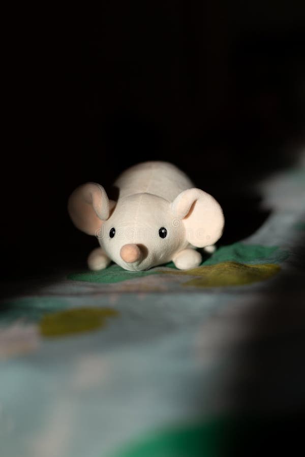 Selective Focus View of Small Stuffed Mouse Toy Lying on Bed Stock ...