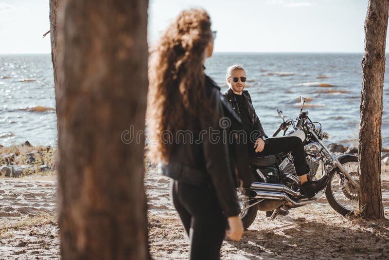 Selective Focus of Woman Looking at Biker Sitting on Classical ...