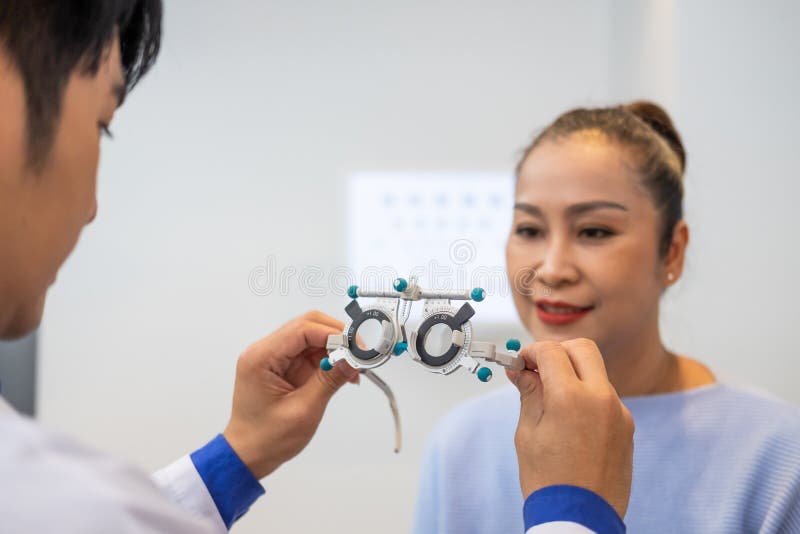 Selective Focus at Women Face. while Doctor Using Optometry Equipment ...