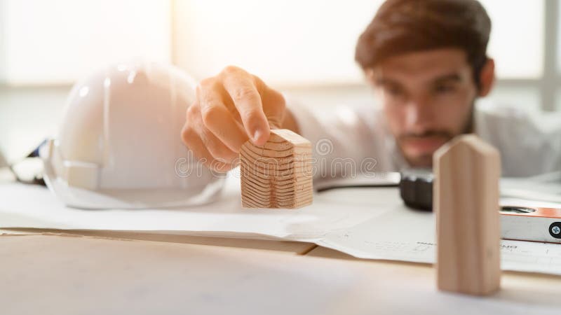 Selective Focus of Wooden House Model Hold by a Construction Engineer ...