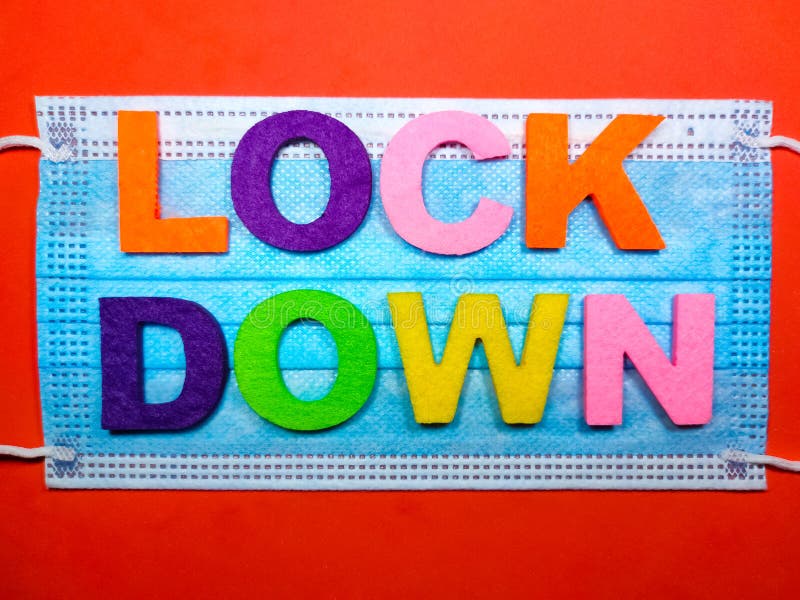 Selective Focus. Word LOCK DOWN and Face Mask on Red Background ...