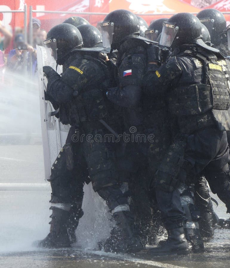 Selective of a Group of Policemen with Shields during a Riot Editorial ...